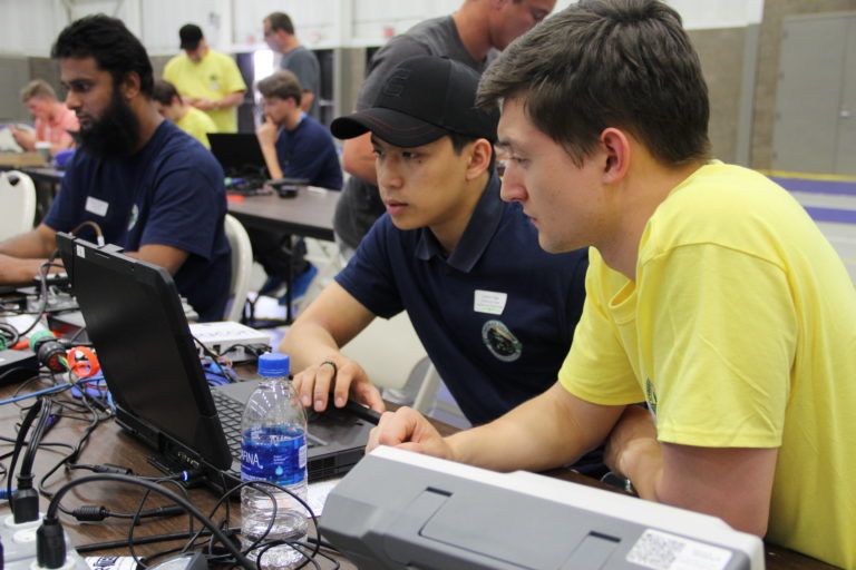 Justin engaged with the computer – CyberTruck Challenge